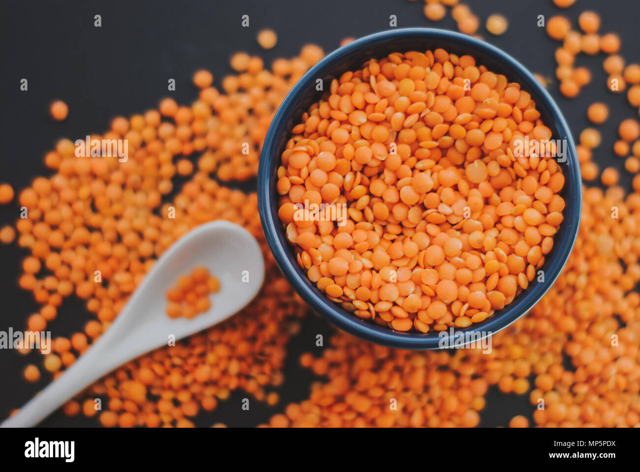 Raw lentil in bowl hi-res stock photography and images - Alamy