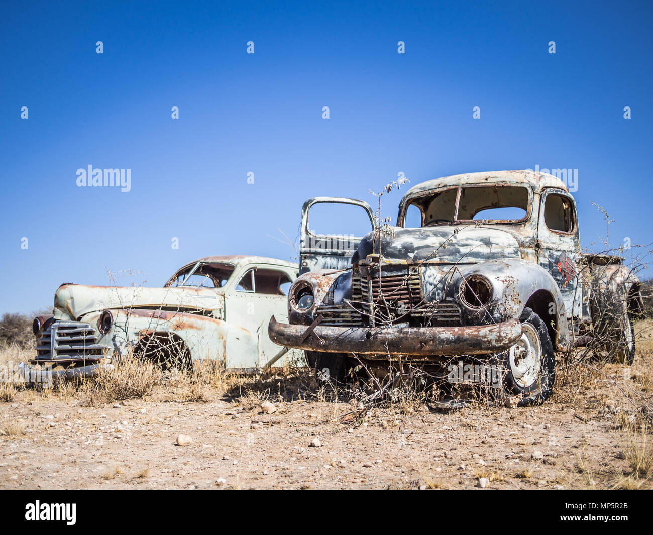 Abandoned classic cars rusting in Namib desert, Namibia Stock Photo - Alamy