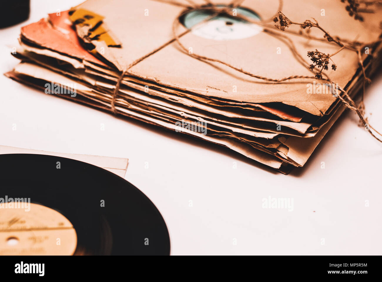 Stack of scratched dusty old vinyl records tied with rope Stock Photo ...