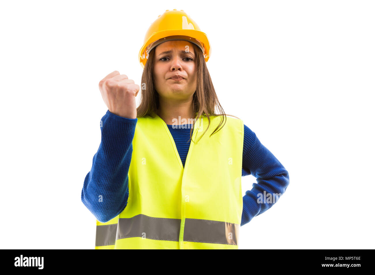 Angry young female architect or engineer showing fist as upset mad boss ...