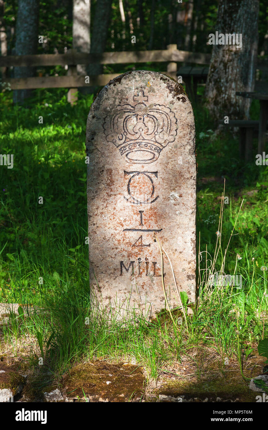 Milestone by the roadside in the countryside Stock Photo - Alamy