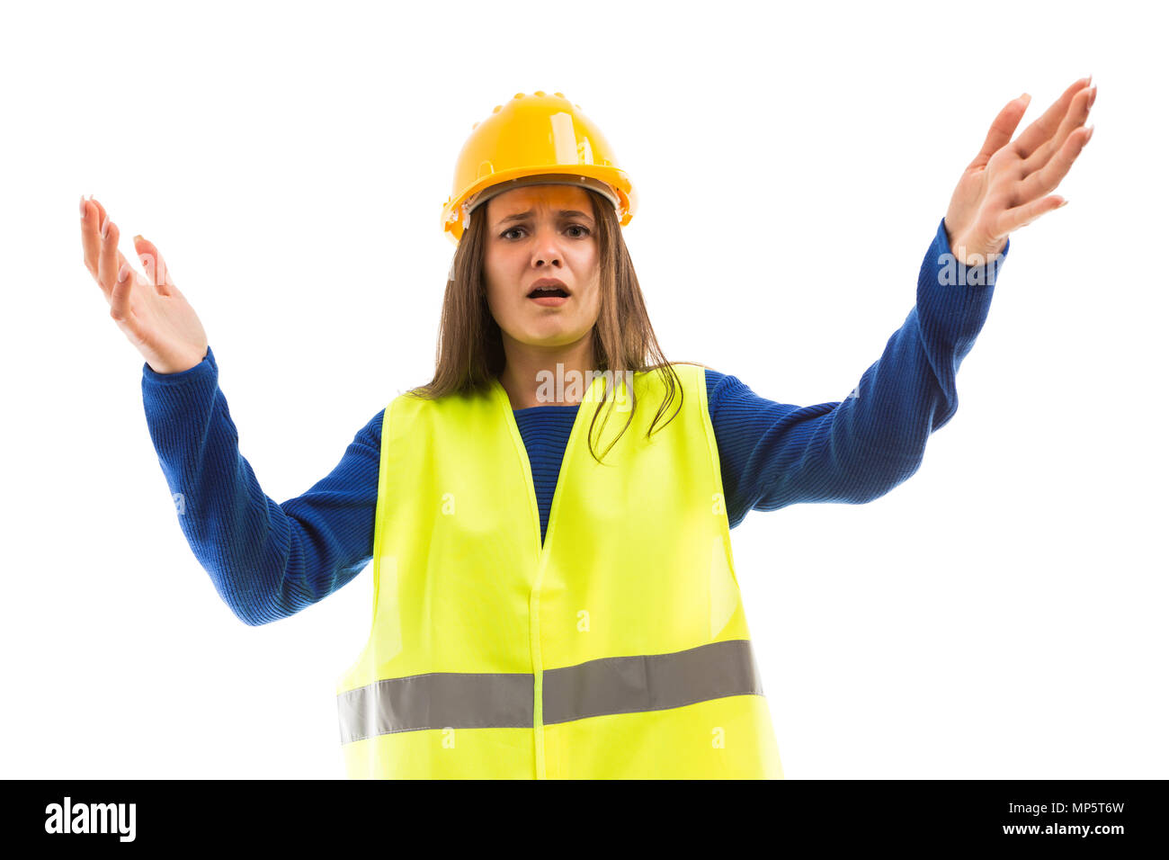 Young female engineer or architect making angry confused gesture with ...