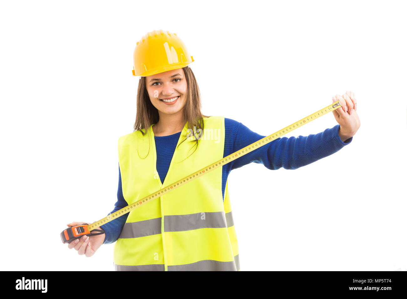 Young cheerful woman architect or engineer holding measuring tape with ...