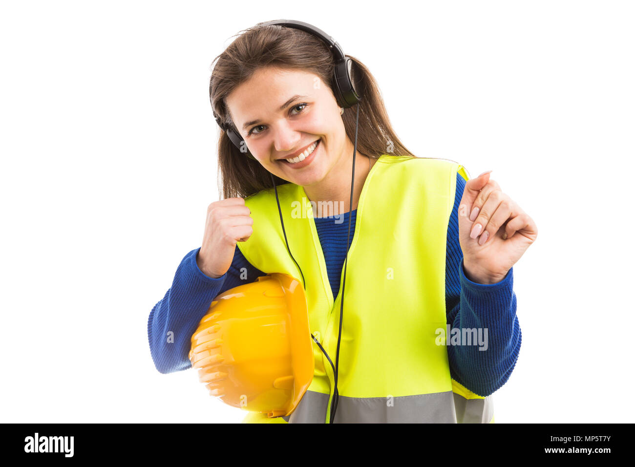 Young attractive female engineer or architect listening to music and ...