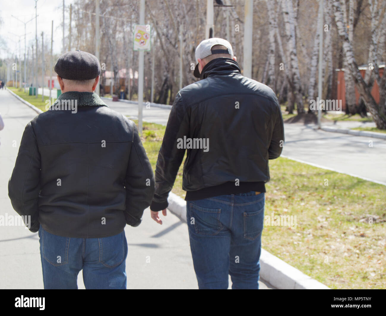 Two men walk through autumn hi-res stock photography and images - Alamy