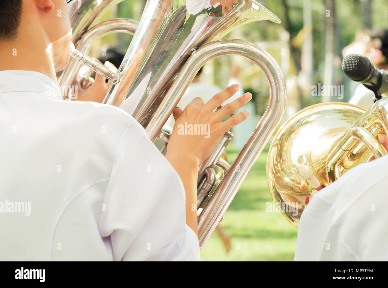 Close up musician blowing the tuba at outdoor concert Stock Photo - Alamy