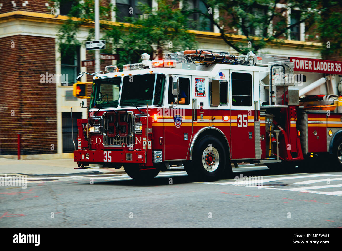 Firetruck driving hi-res stock photography and images - Alamy