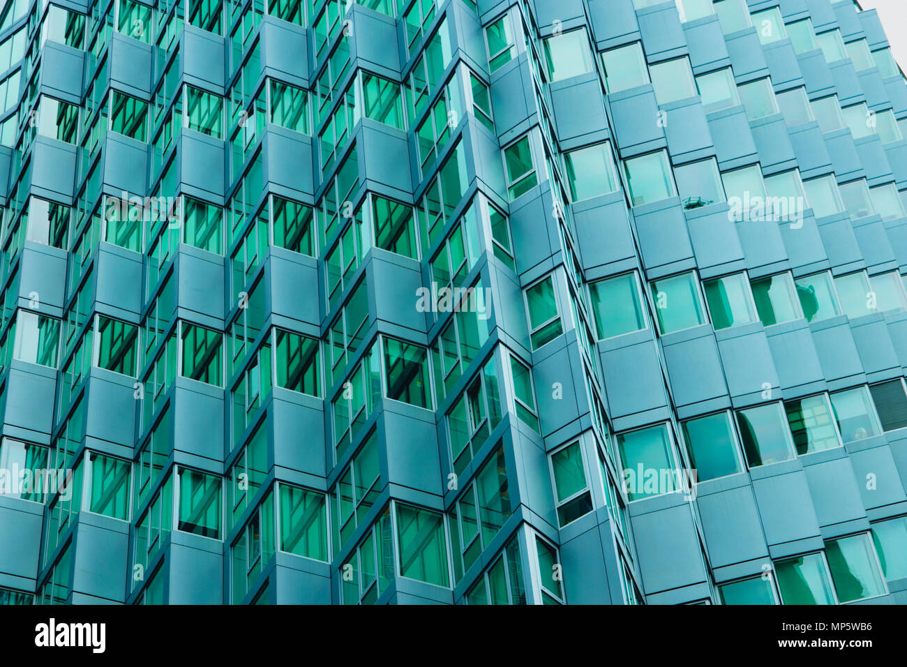 Blue and green glass building Stock Photo - Alamy
