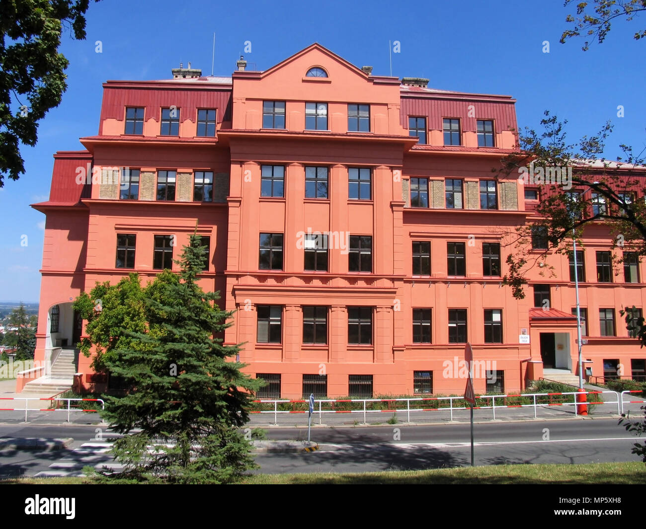 Old red building of an elementary school Stock Photo - Alamy