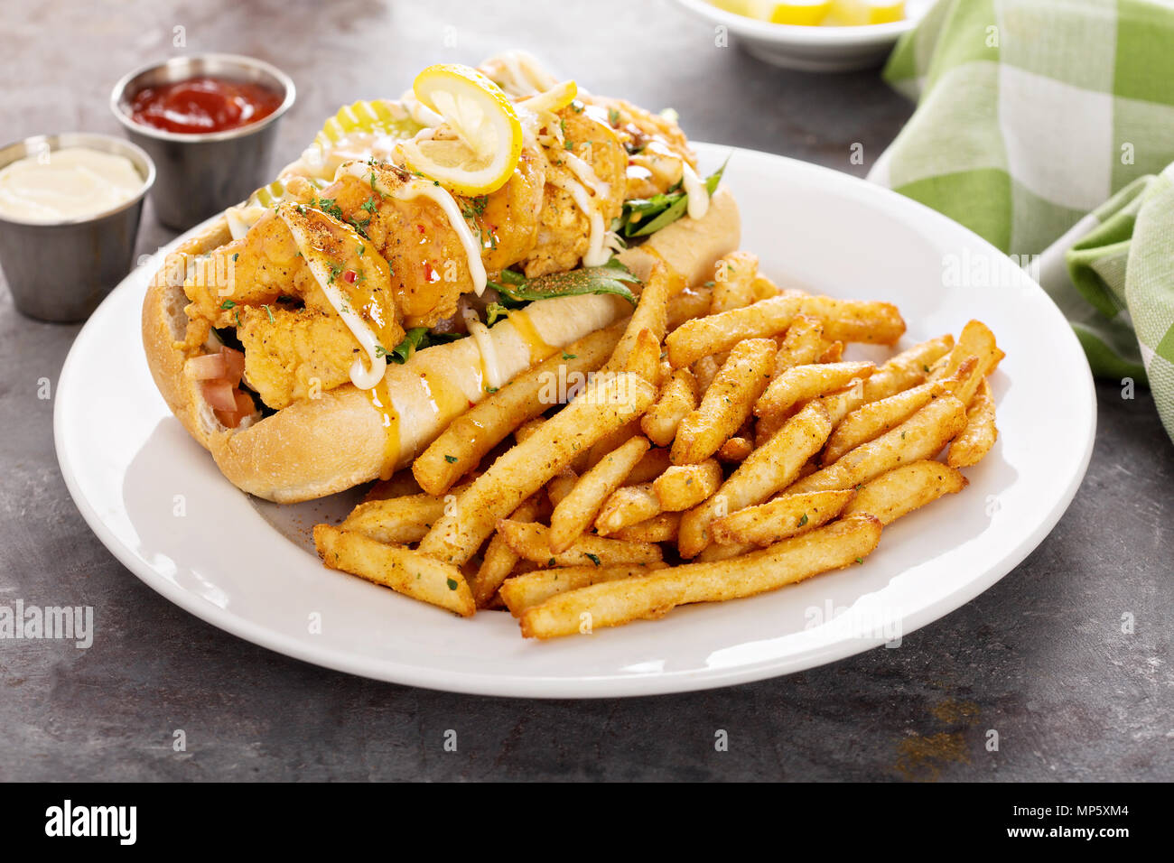 Shrimp po boy sandwich with fries Stock Photo - Alamy
