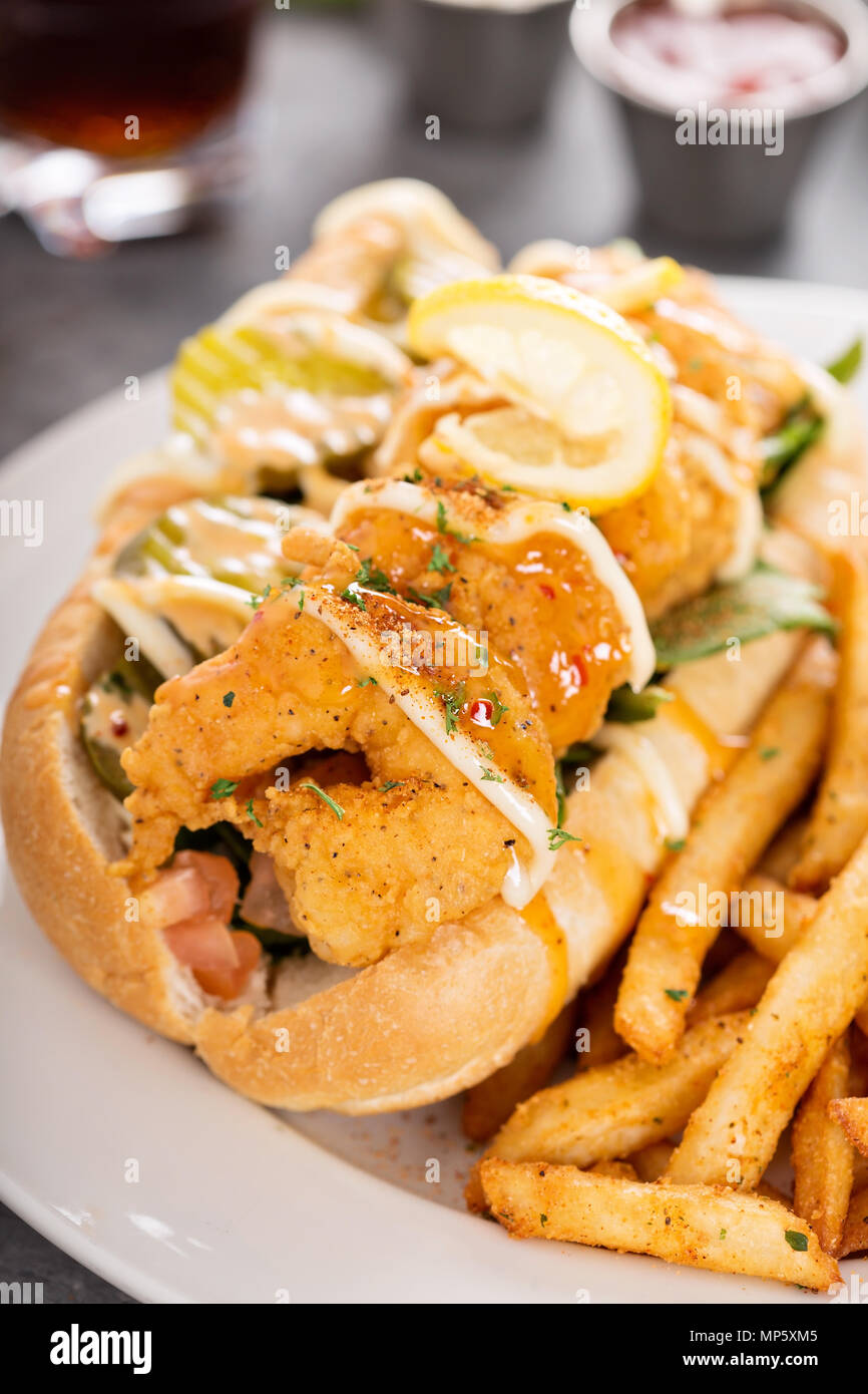 Shrimp po boy sandwich with fries Stock Photo - Alamy