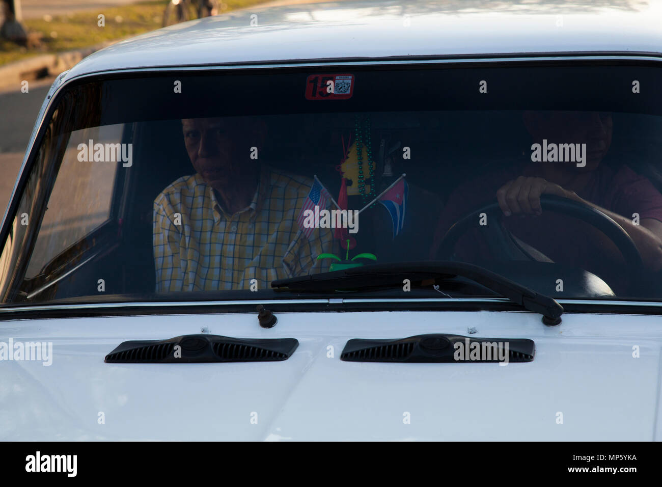 Cuban and American flag flown inside car in Havana Cuba Stock Photo - Alamy