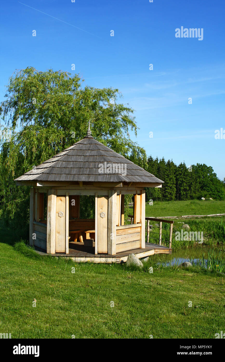 Traditional wooden summer house on the park garden Stock Photo - Alamy