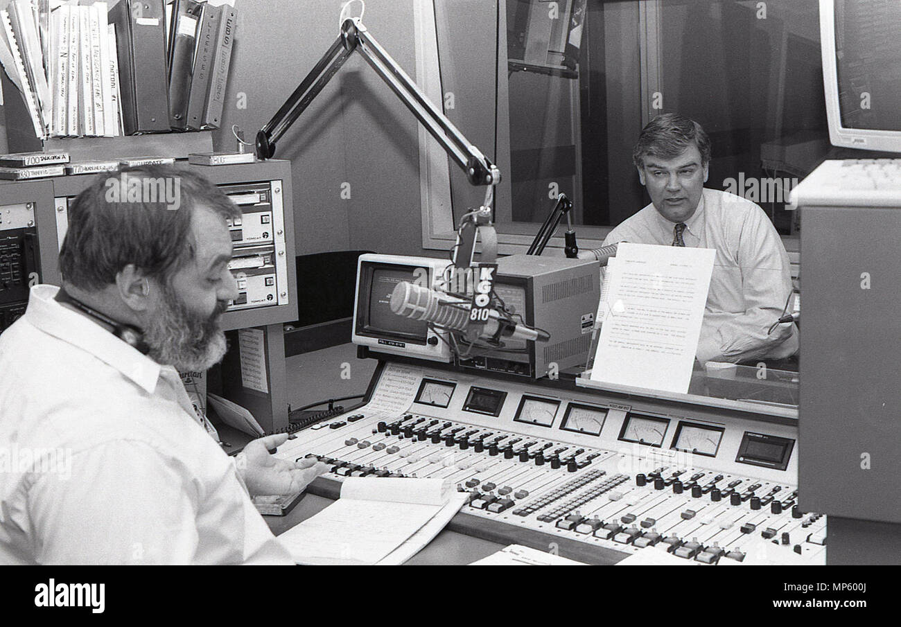 men sitting at computer and otherequipment looks like radio station kgo ...