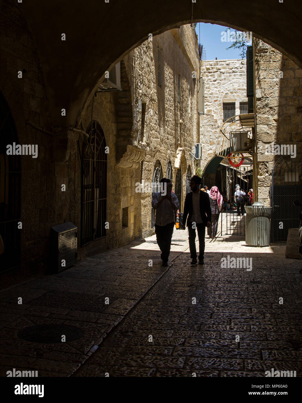 Jerusalem, Israel - May 11, 2018: Local people in ancient cobblestone ...