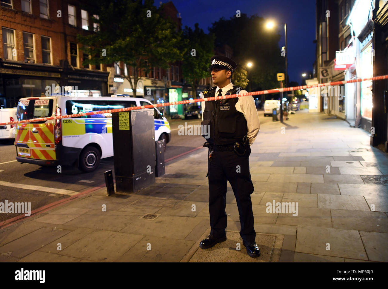 A police officer at the scene on Upper Street in Islington, north ...