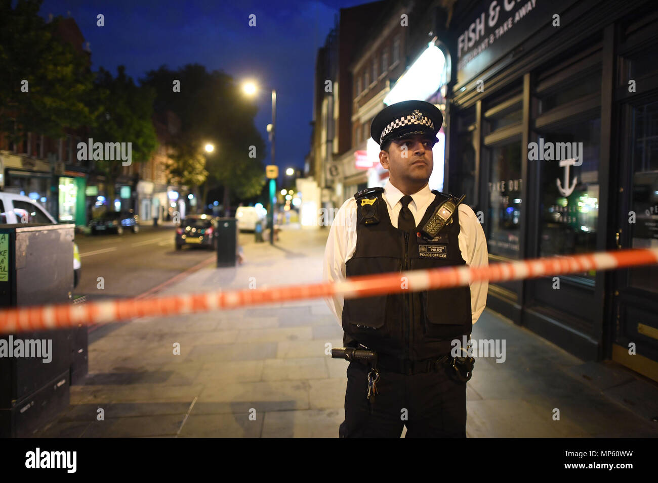 A police officer at the scene on Upper Street in Islington, north ...