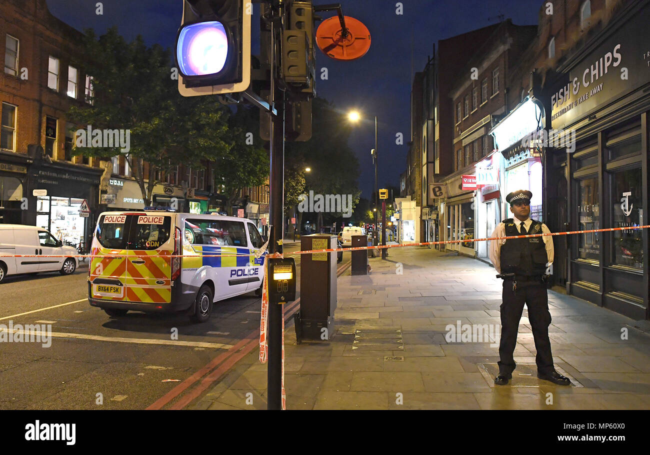 A police officer at the scene on Upper Street in Islington, north ...