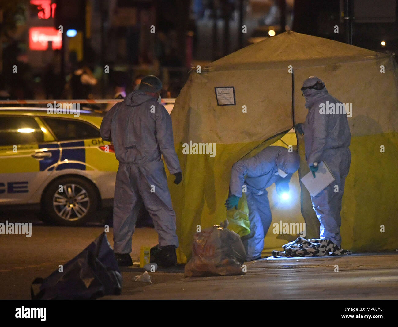 Forensic officers at the scene on Upper Street in Islington, north ...