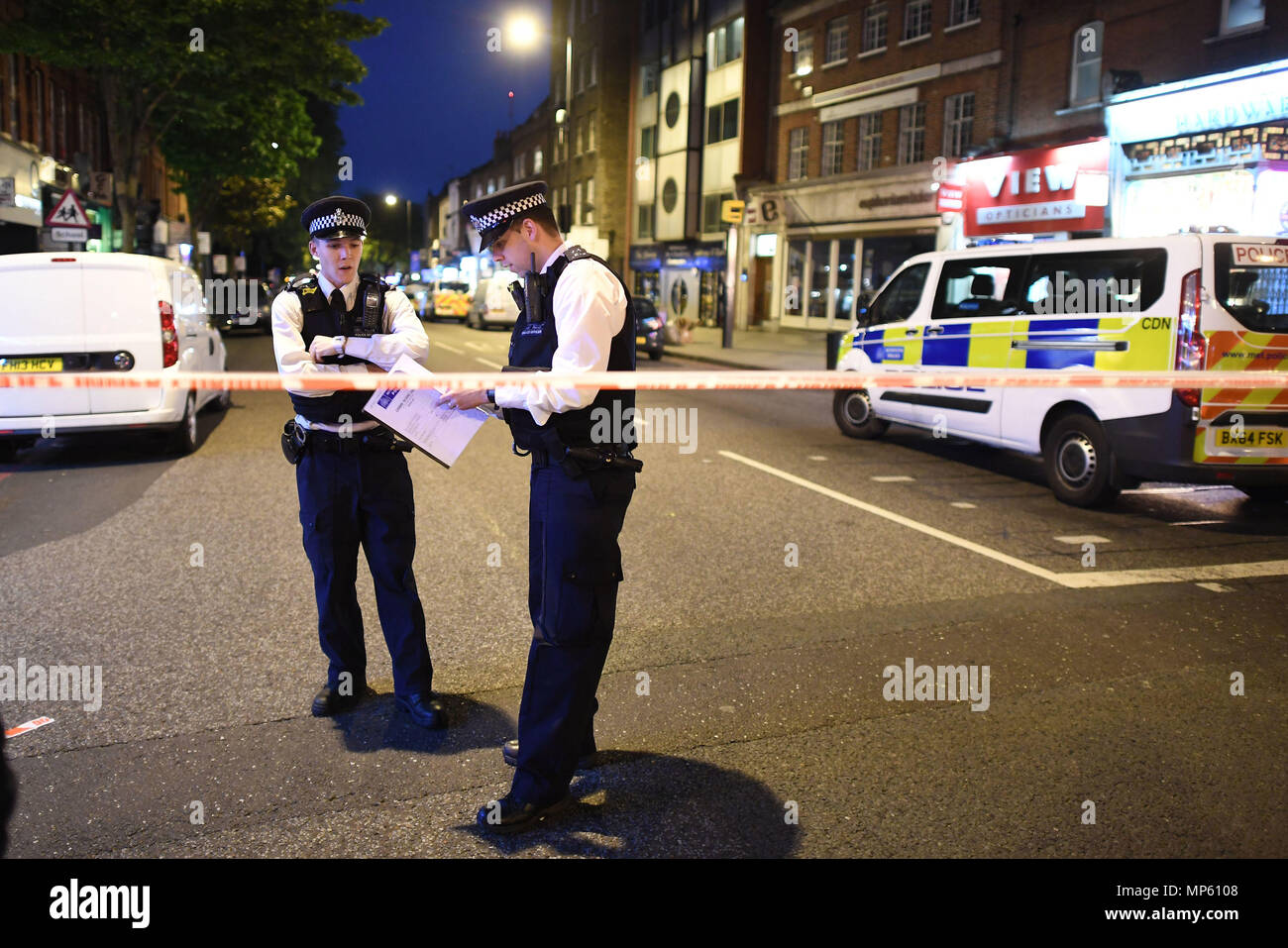 Police officers at the scene on upper street in islington hi-res stock ...