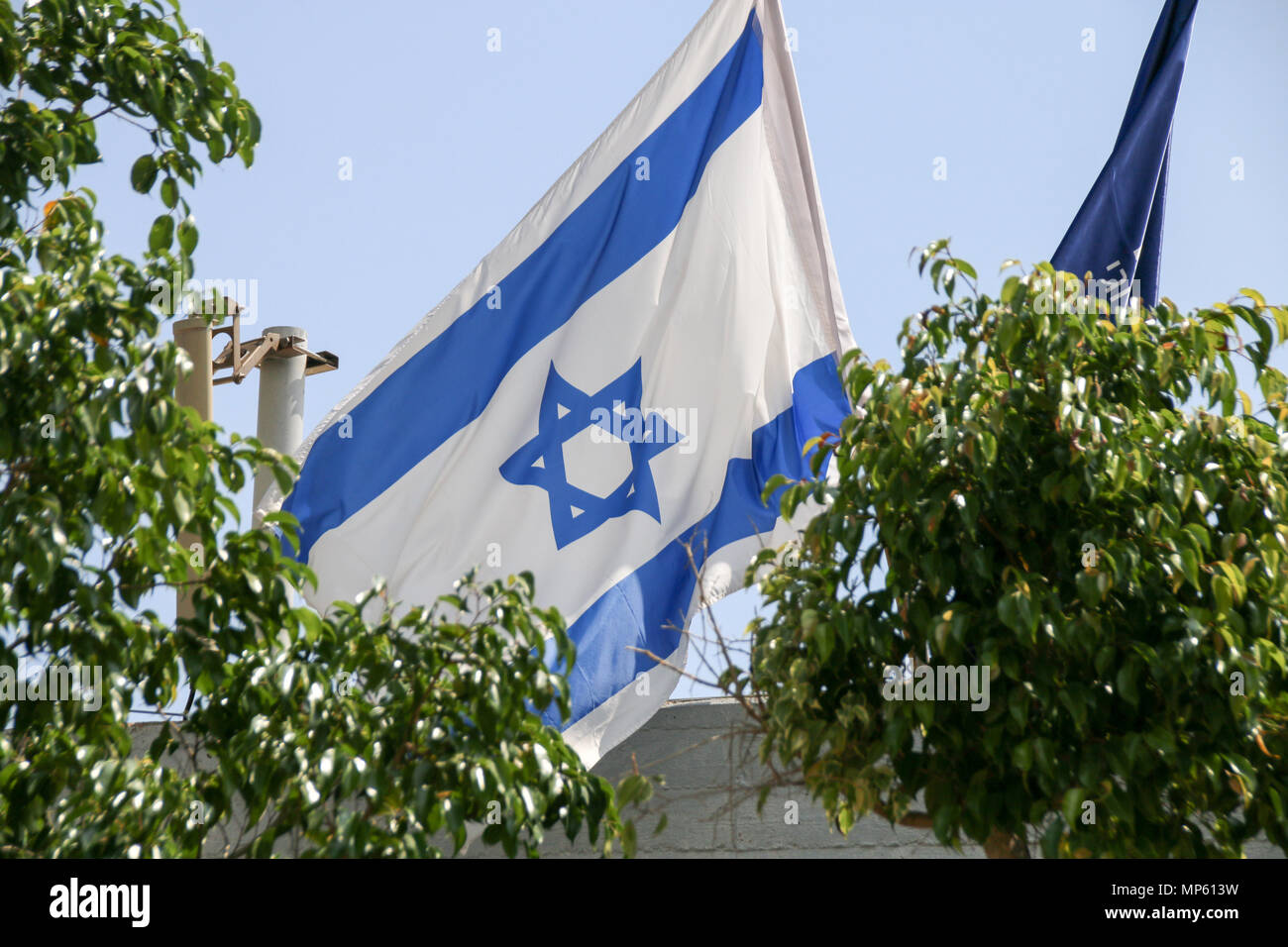 The Israeli national flag as it hangs on many buildings in the Holy ...
