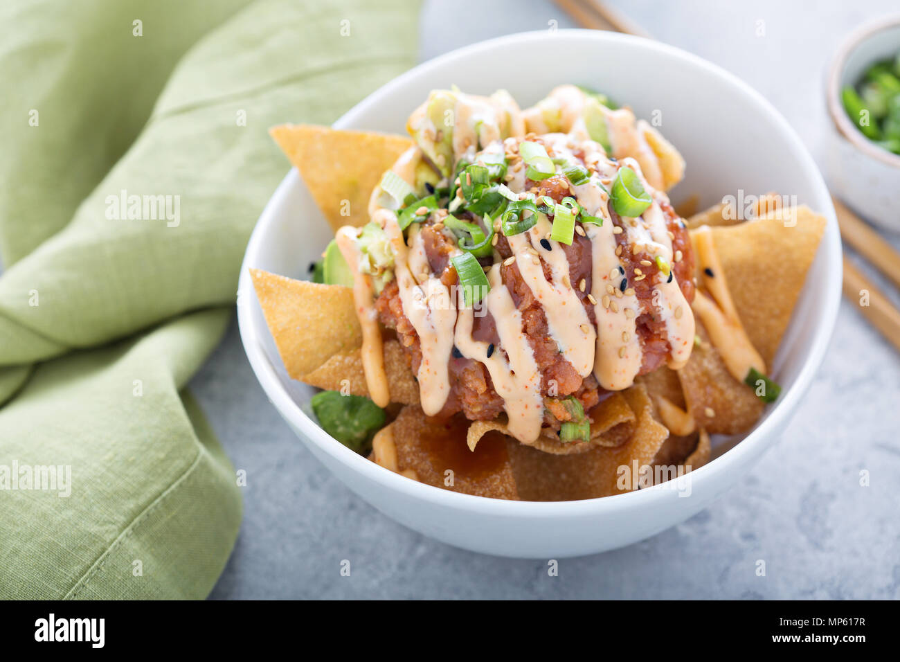 Poke bowl with fried wonton wrappers Stock Photo - Alamy