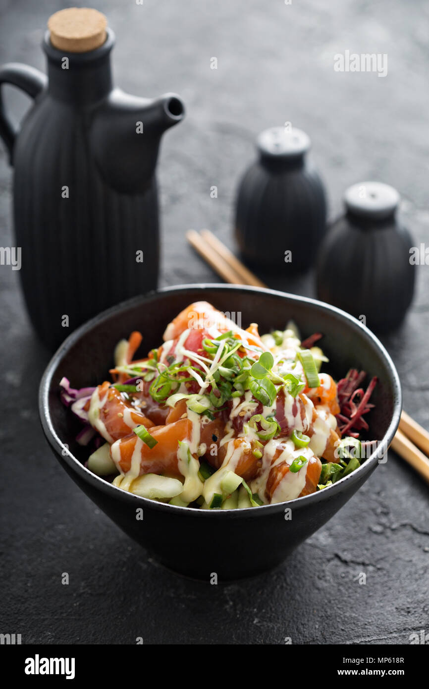 Poke bowl with salmon and vegetables Stock Photo - Alamy