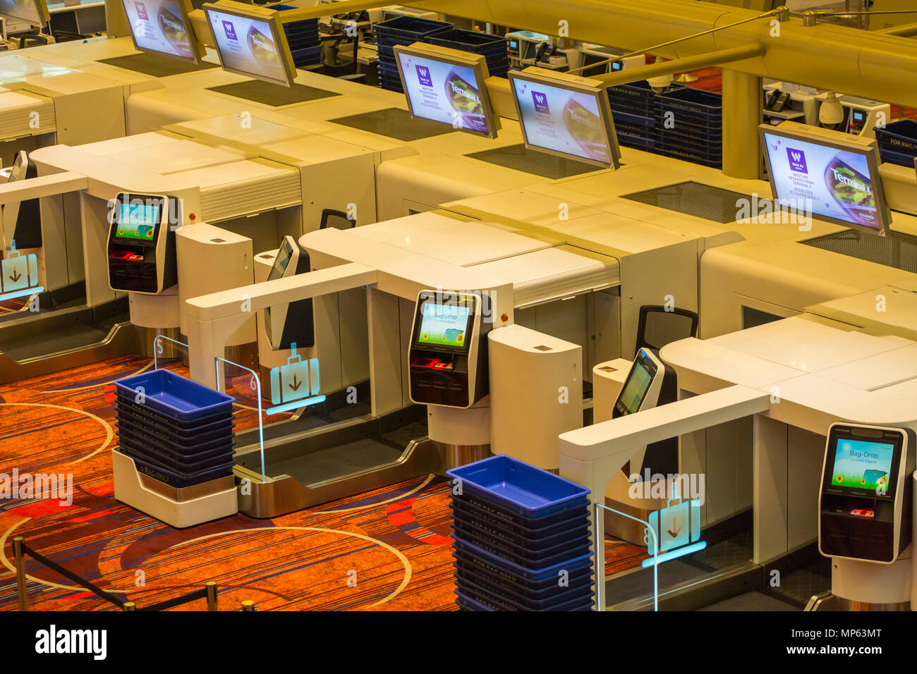 2018. Top down view of an automated bag drop system service at Changi ...