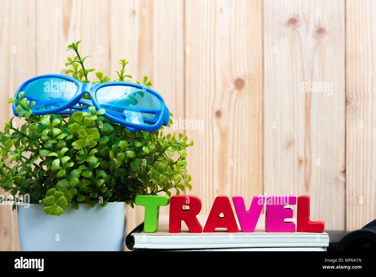 TRAVEL letters text and notebook paper, and little decoration tree in ...