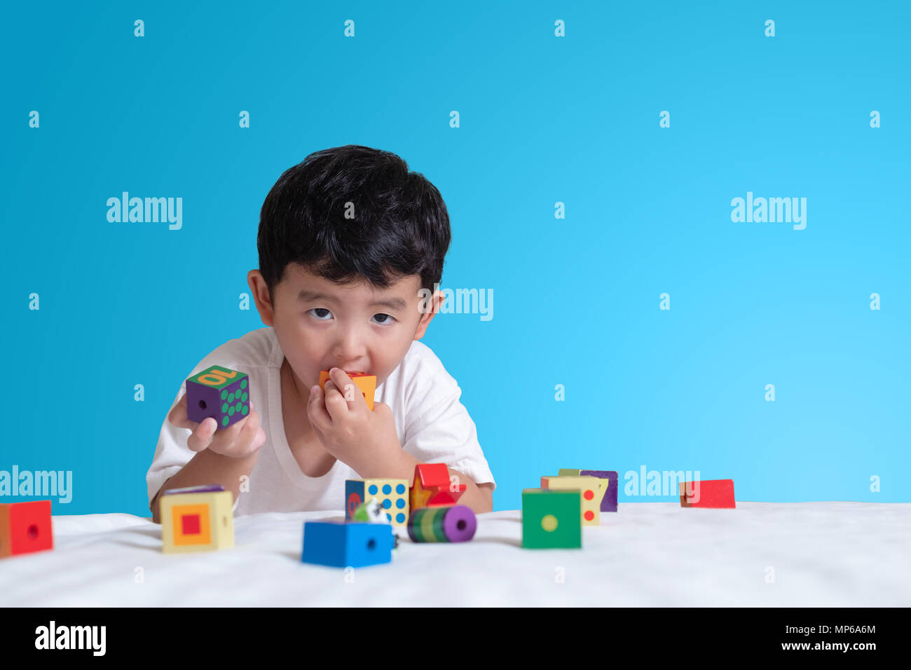 3 years old little cute Asian boy play toy or square block puzzle at ...