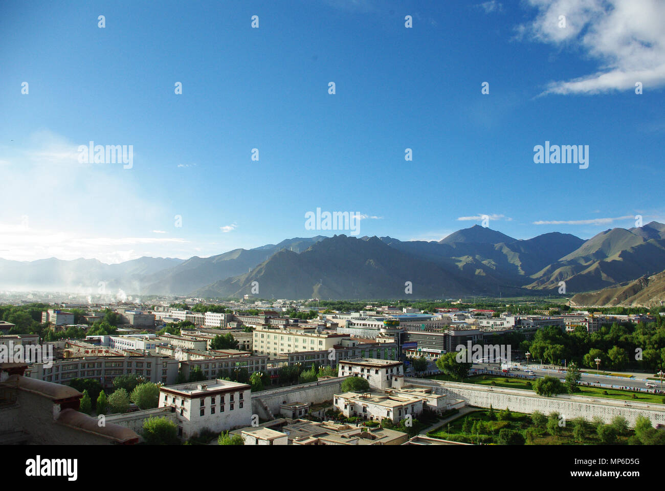 View of Lhasa in the morning sun from Potala Palace. Blue Sky white ...