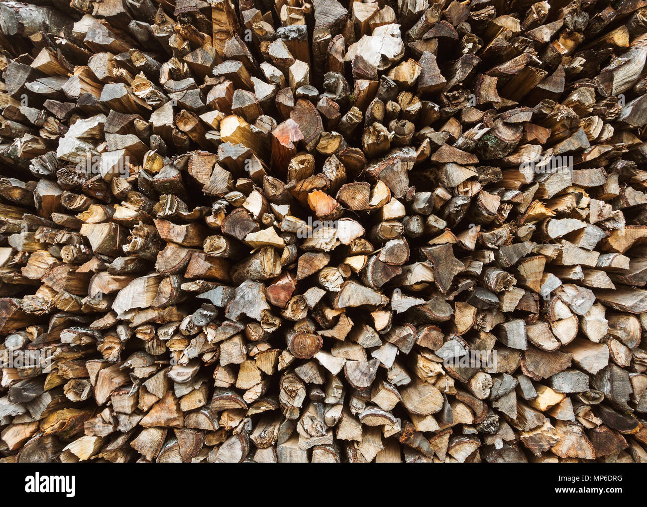 Stack of firewood, chopped firewood background Stock Photo - Alamy