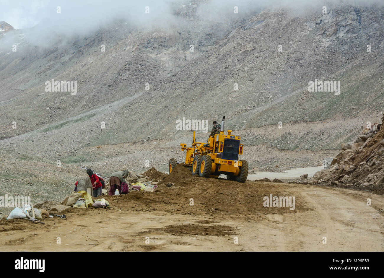 Ladakh, India - Jul 18, 2015. An excavator loader machine working on ...