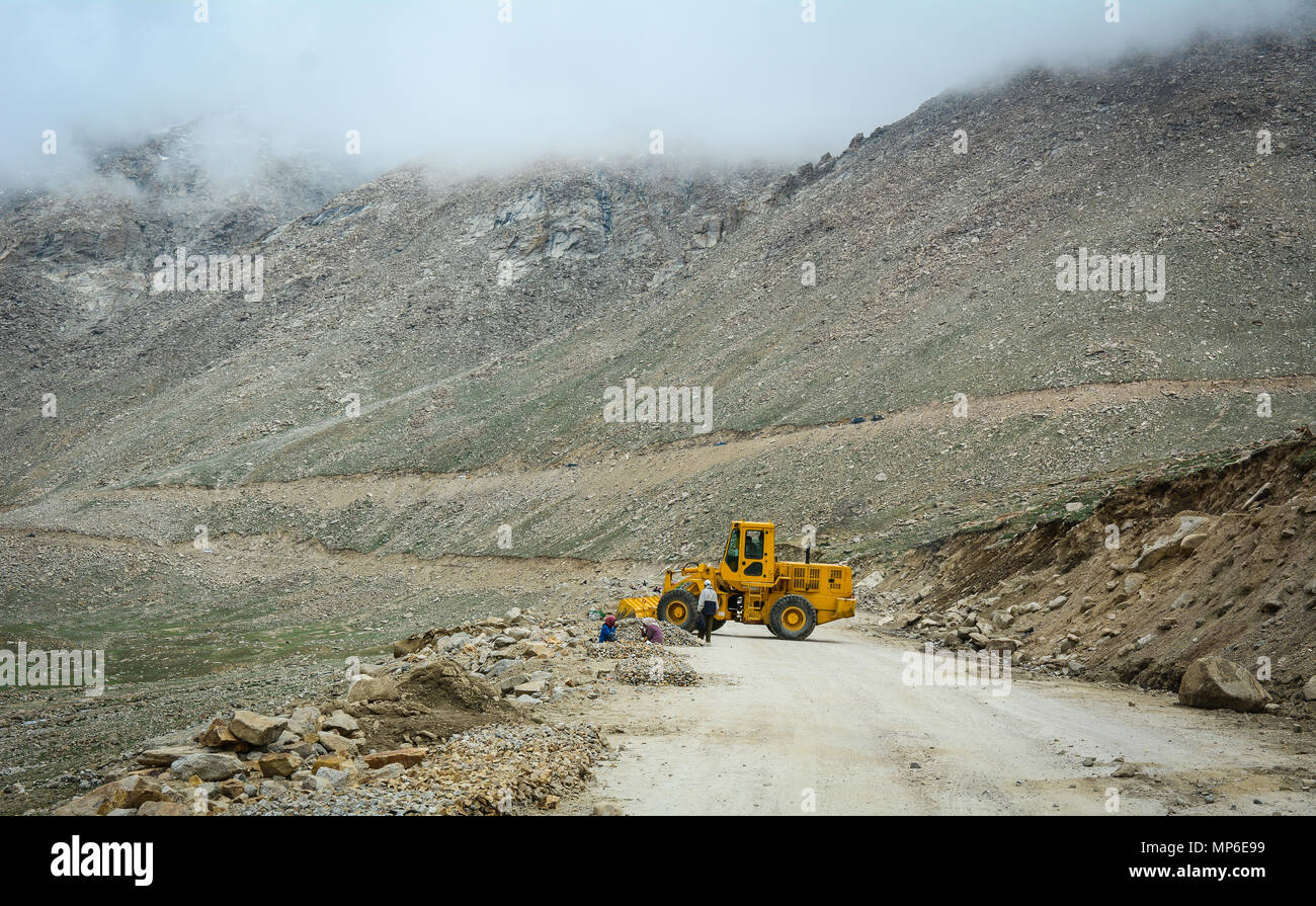 Ladakh, India - Jul 18, 2015. An excavator loader machine working on ...