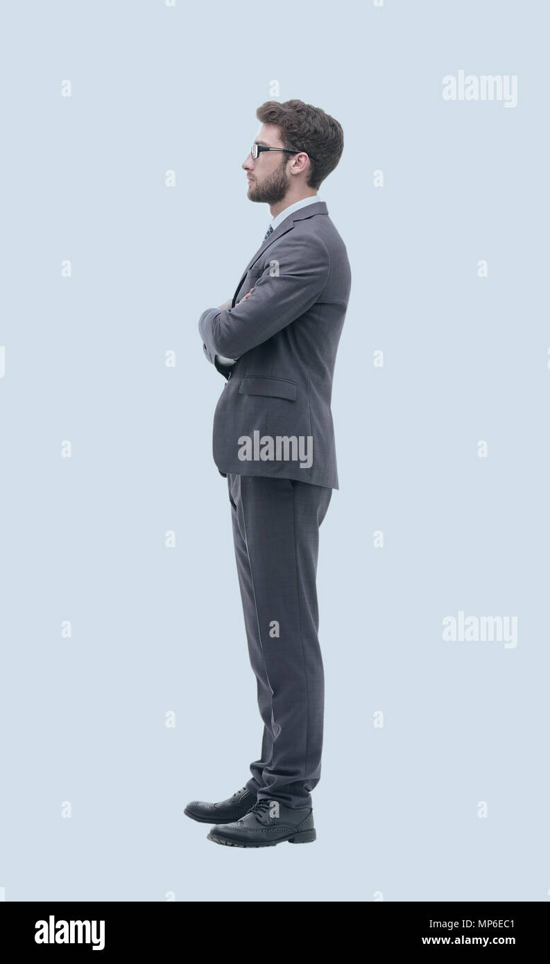 Side view - businessman stands with folded arms in front of him. photo ...