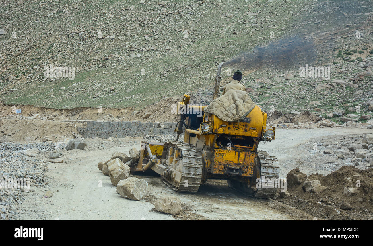 Ladakh, India - Jul 18, 2015. An excavator loader machine working on ...