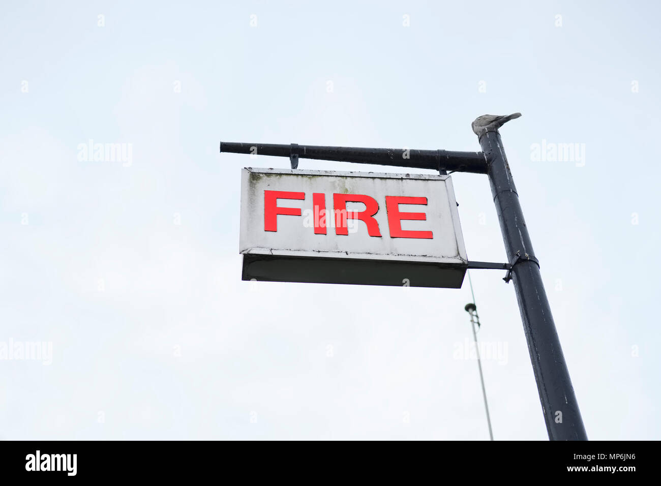 Fire station sign in sky blank post single isolated red white Stock ...