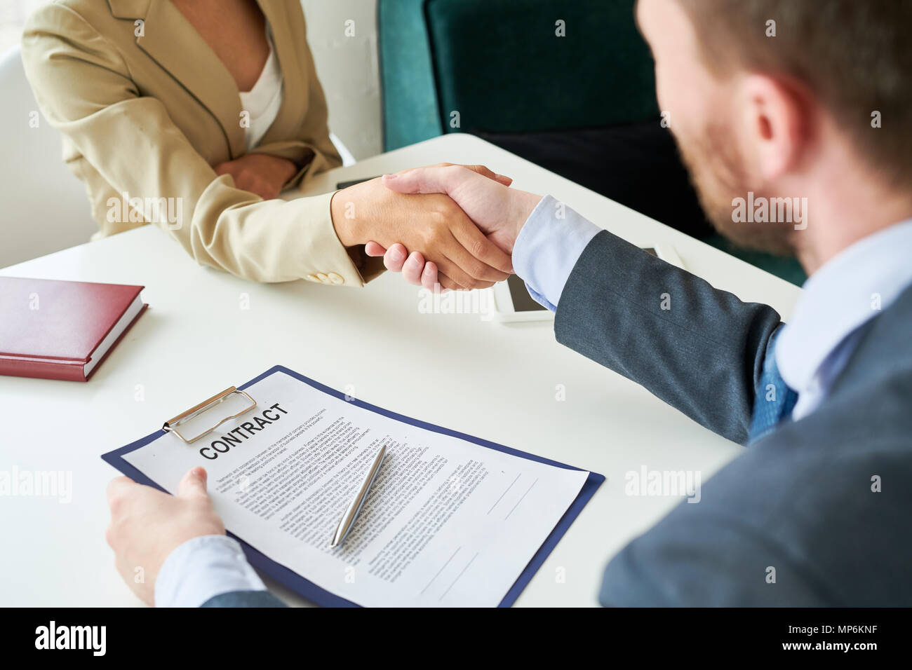 Business People Shaking Hands over Contract Stock Photo - Alamy