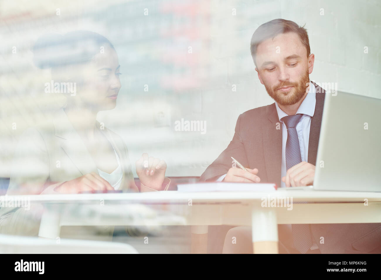 Handsome Businessman Behind Glass Wall Stock Photo - Alamy