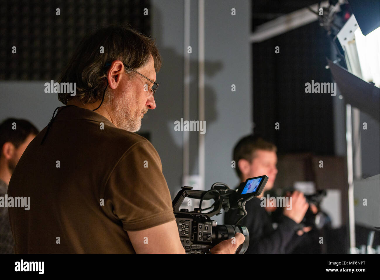 camera operator working with a cinema camera Stock Photo - Alamy
