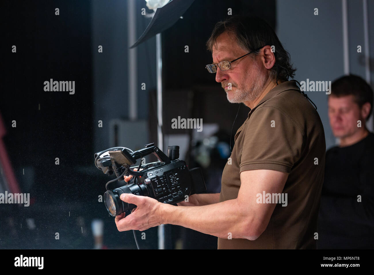 camera operator working with a cinema camera Stock Photo - Alamy