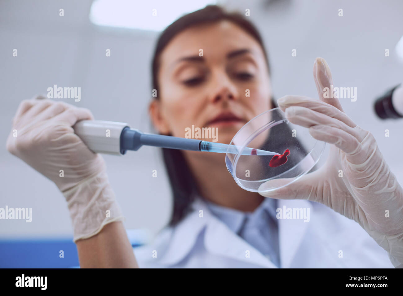 Woman doing blood analysis hi-res stock photography and images - Alamy