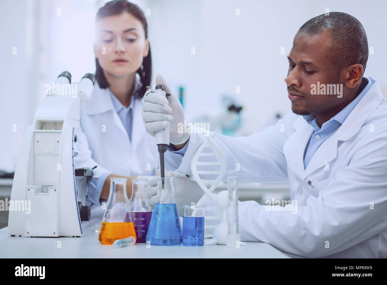 Determined scientists carrying out a test Stock Photo - Alamy
