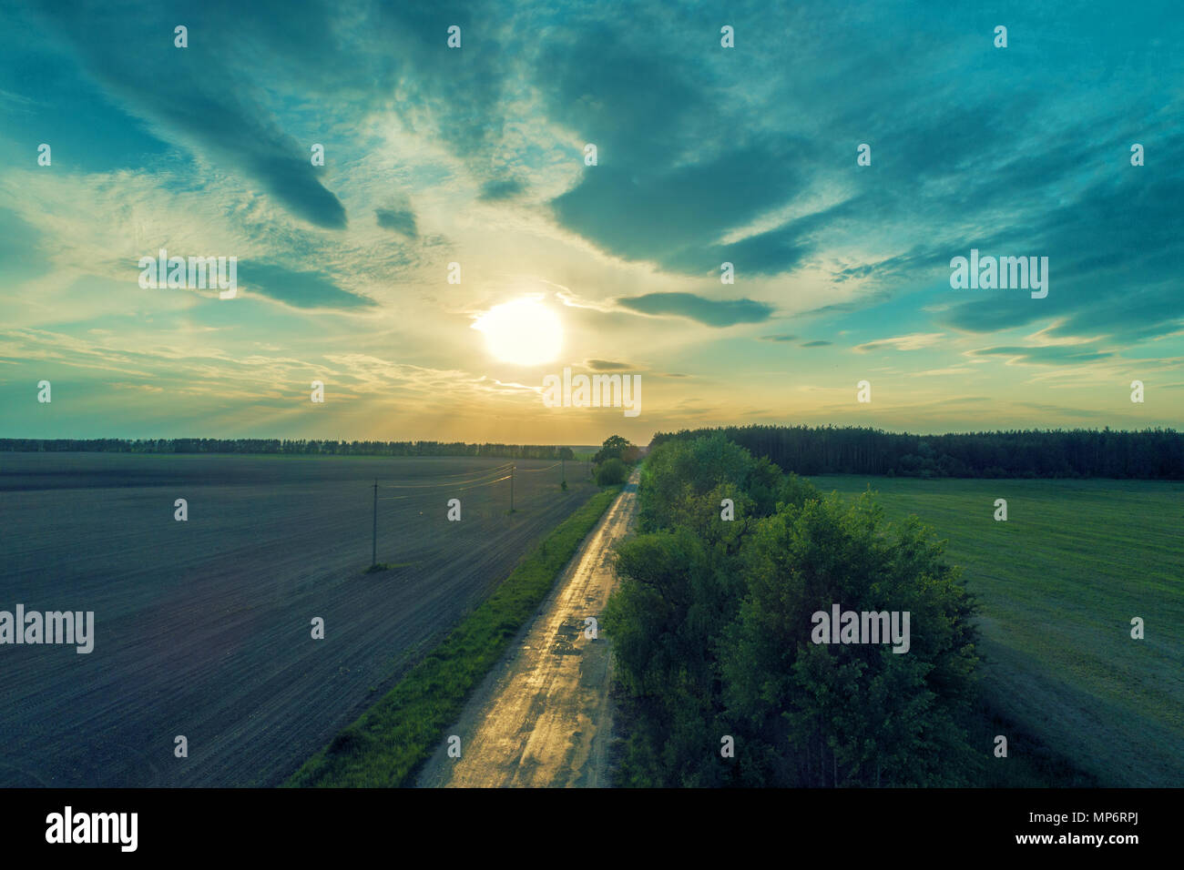Aerial view of a country road at sunset. Rural evening landscape Stock ...