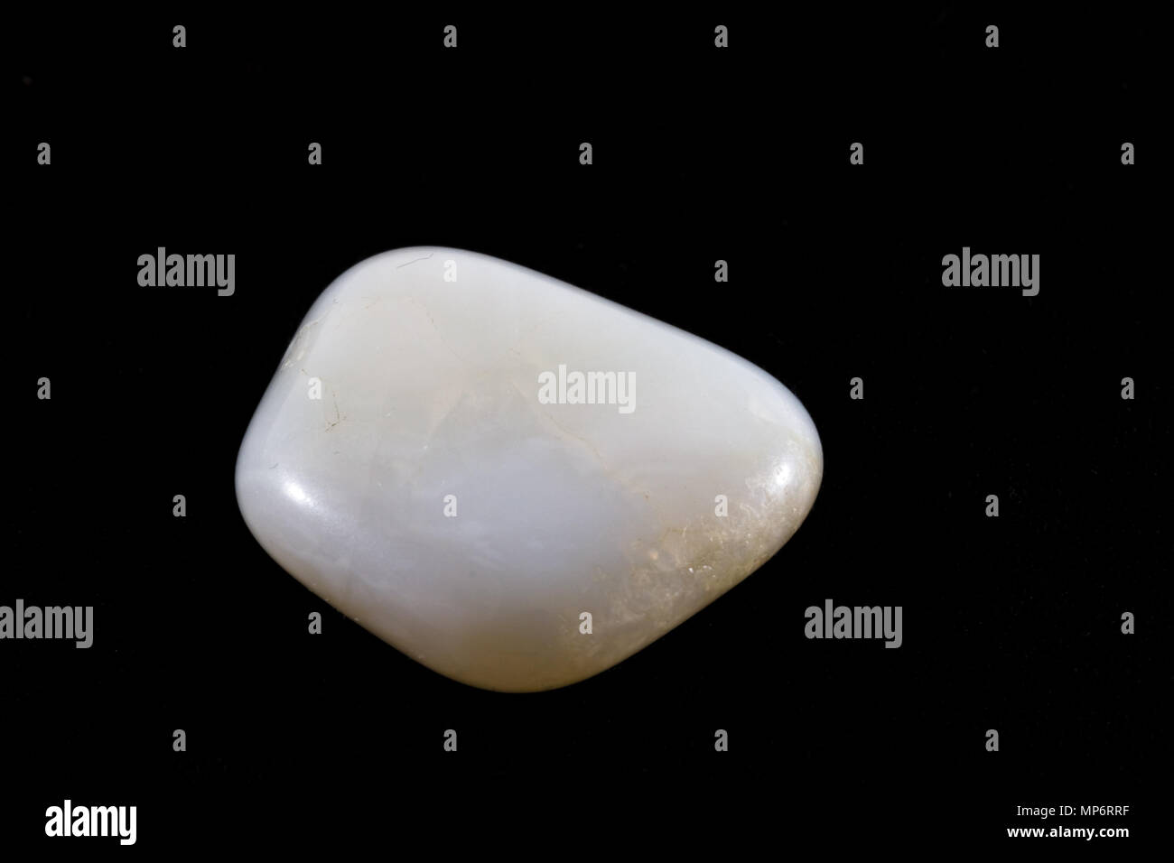 Tumbled White Opal Gemstone Stock Photo - Alamy