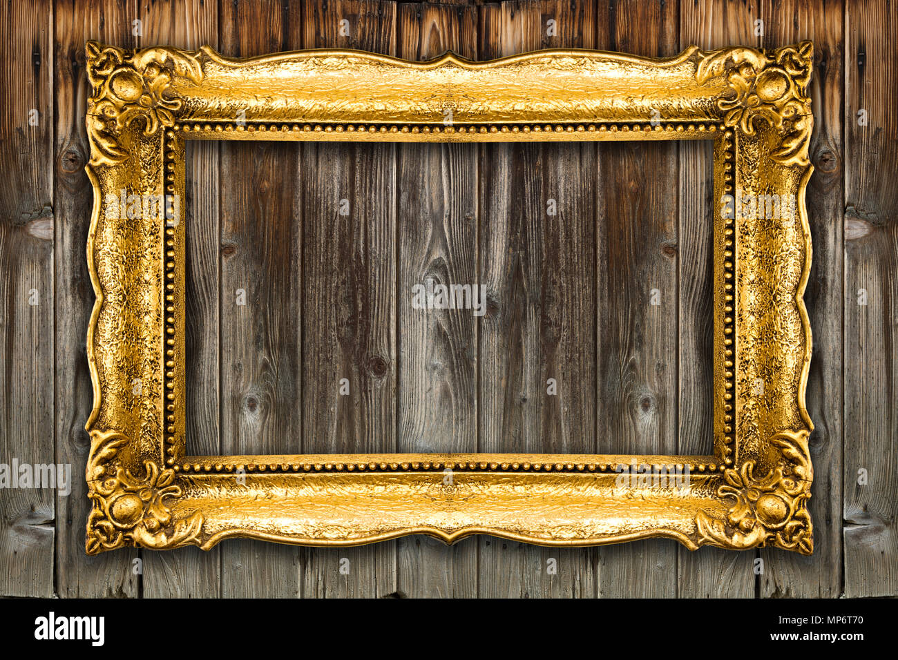 Big Old Picture Frame on wooden baclground Stock Photo - Alamy