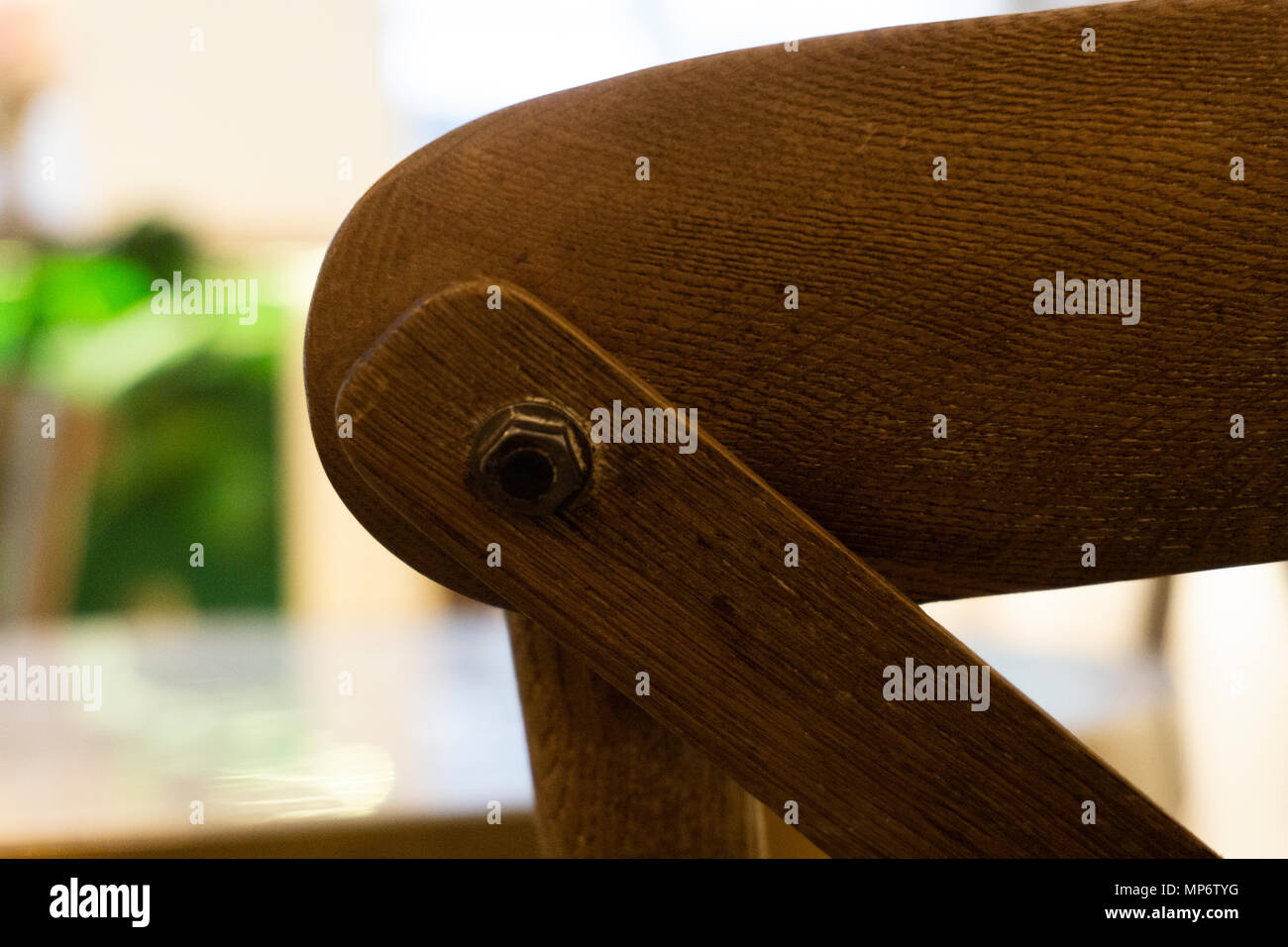 Retro wooden chair with metallic pin detail Stock Photo - Alamy