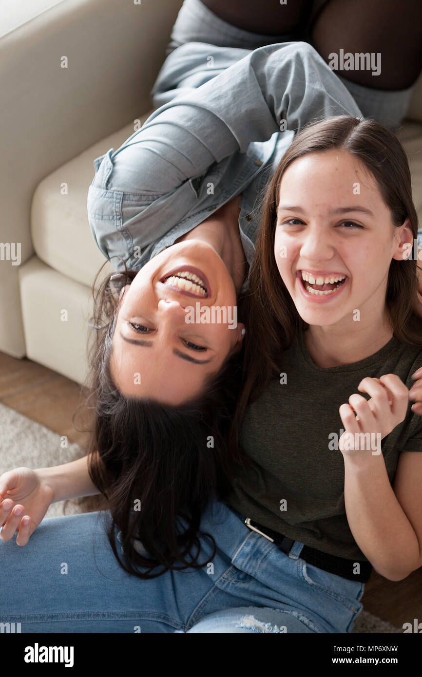 Two sisters have fun in the room Stock Photo - Alamy