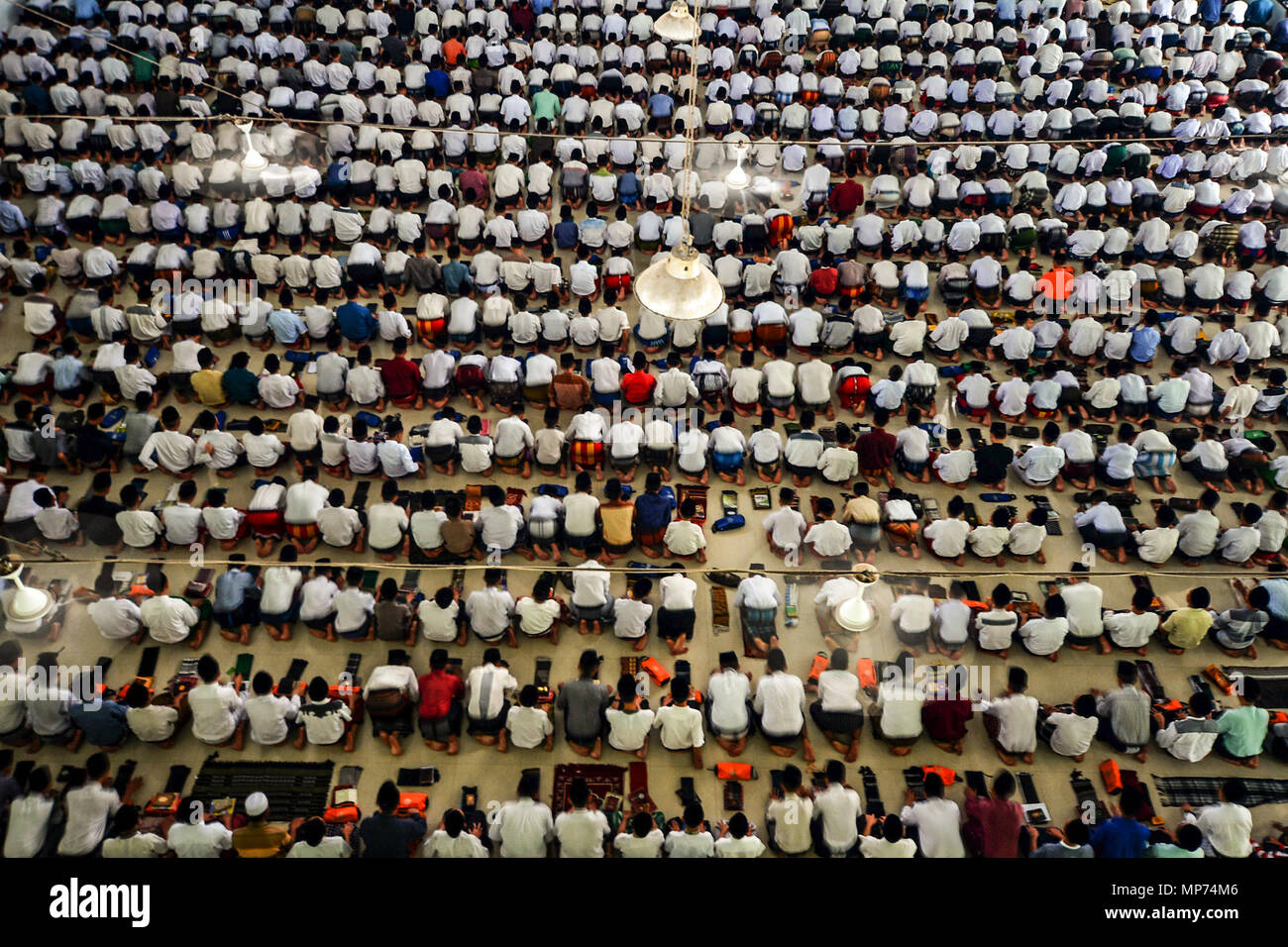 Students perform prayers and recite al-quran during the fasting month ...