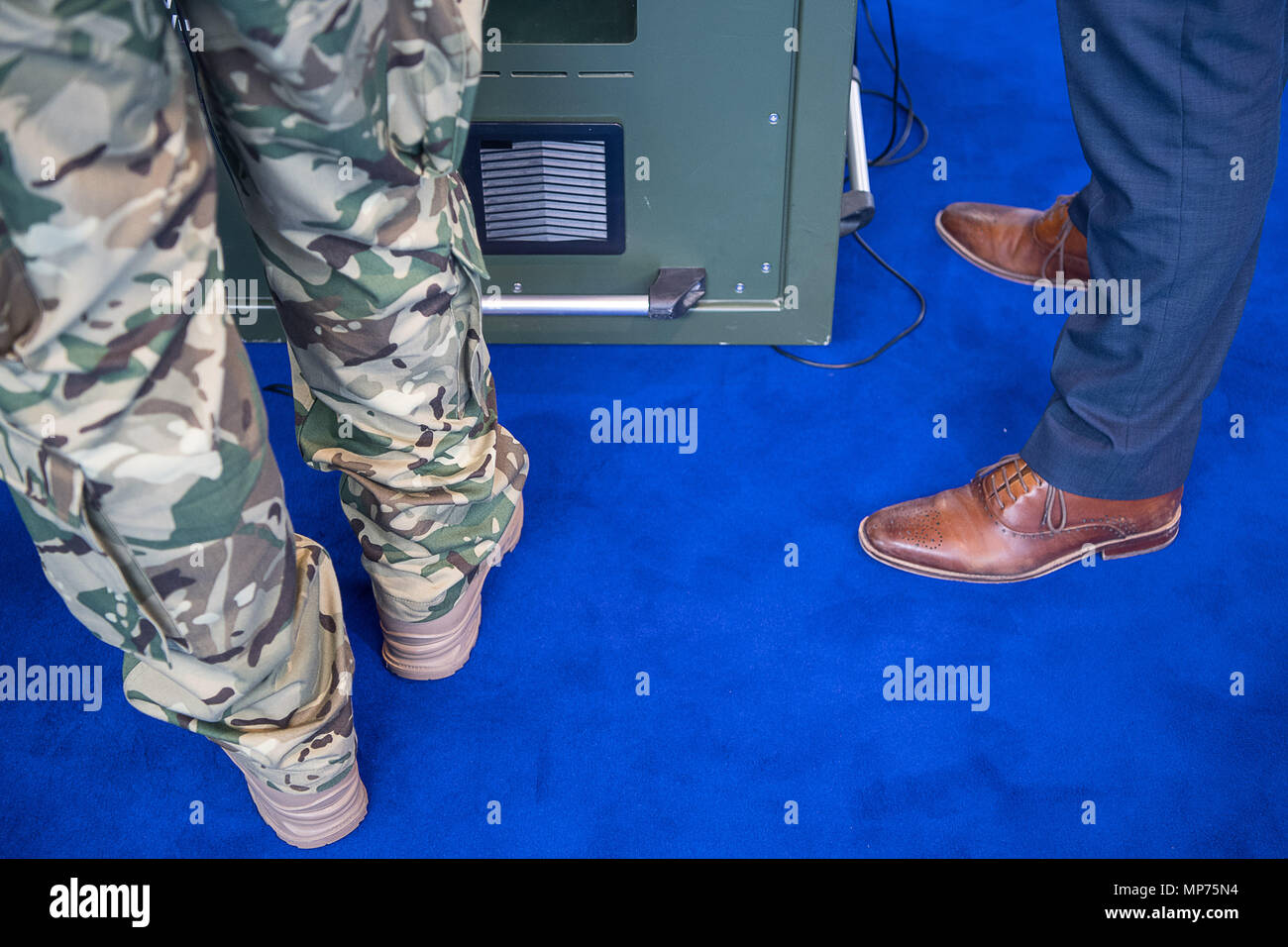 15 May 2018, Germany, Stuttgart: A man in military pants and a man in a suit standing next to ...